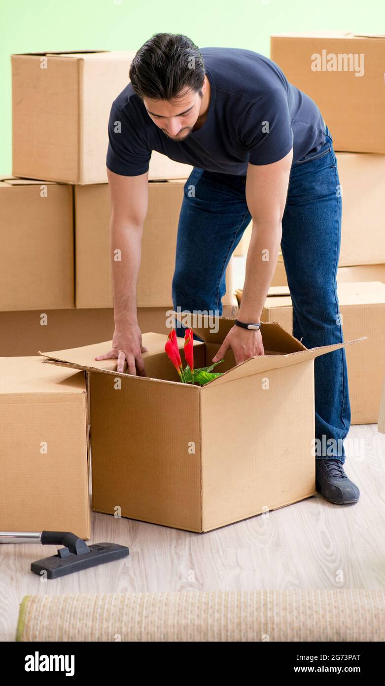 The man moving house with boxes Stock Photo - Alamy
