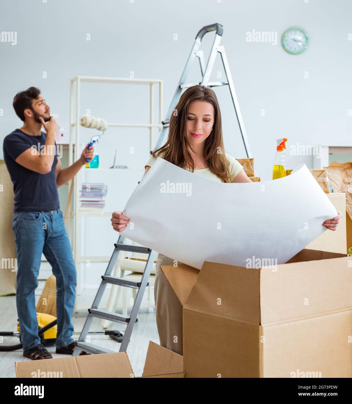 The young family unpacking at new house with boxes Stock Photo - Alamy