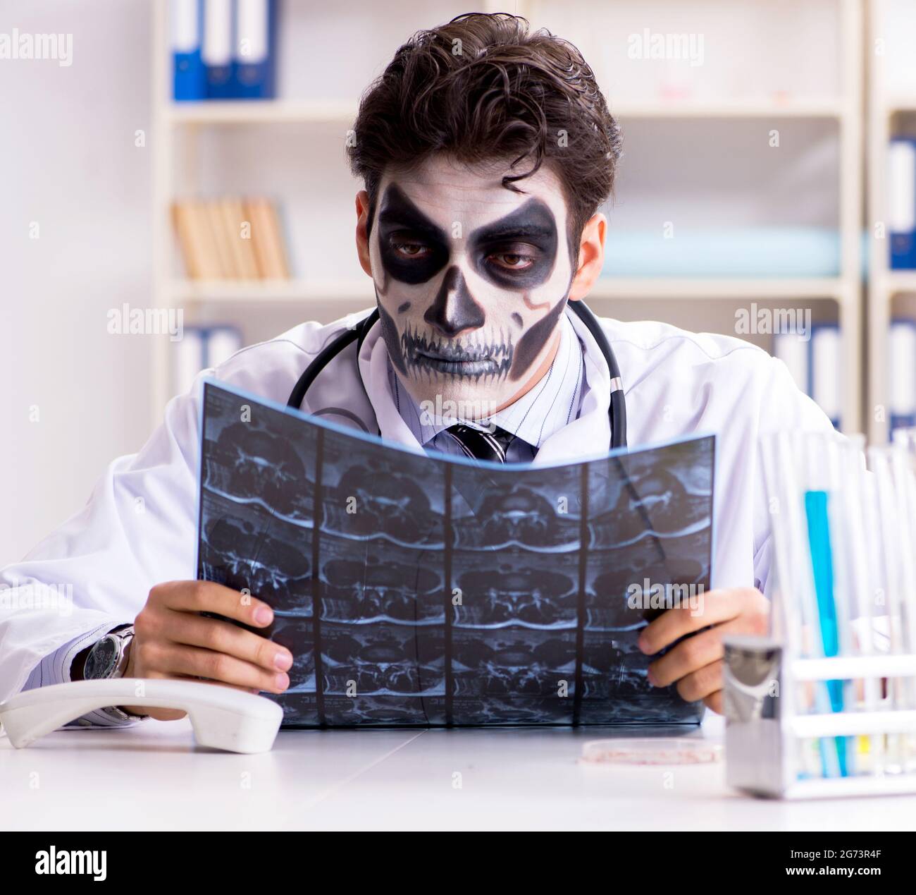 The scary monster doctor working in lab Stock Photo - Alamy