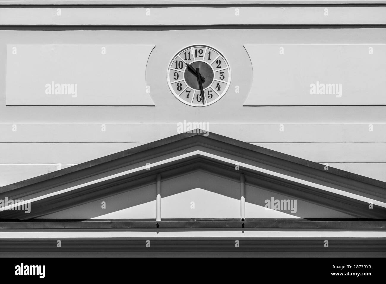 Grayscale closeup of a clock built on a building Stock Photo - Alamy