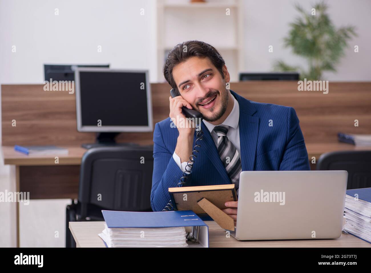 Young employee missing girlfriend at workplace Stock Photo - Alamy