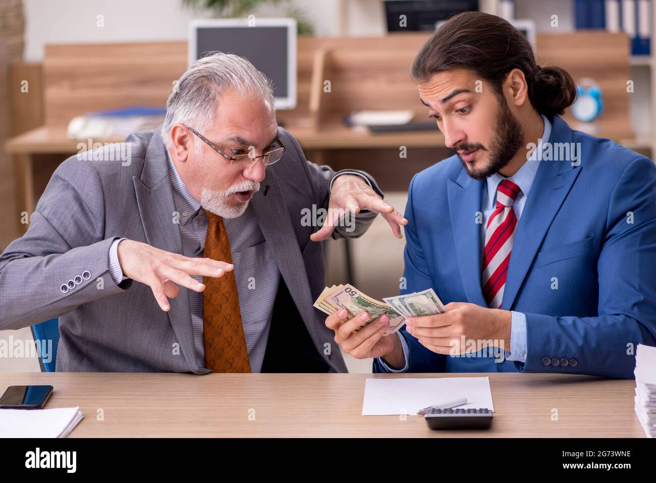 Giving salary to employees hi-res stock photography and images - Alamy