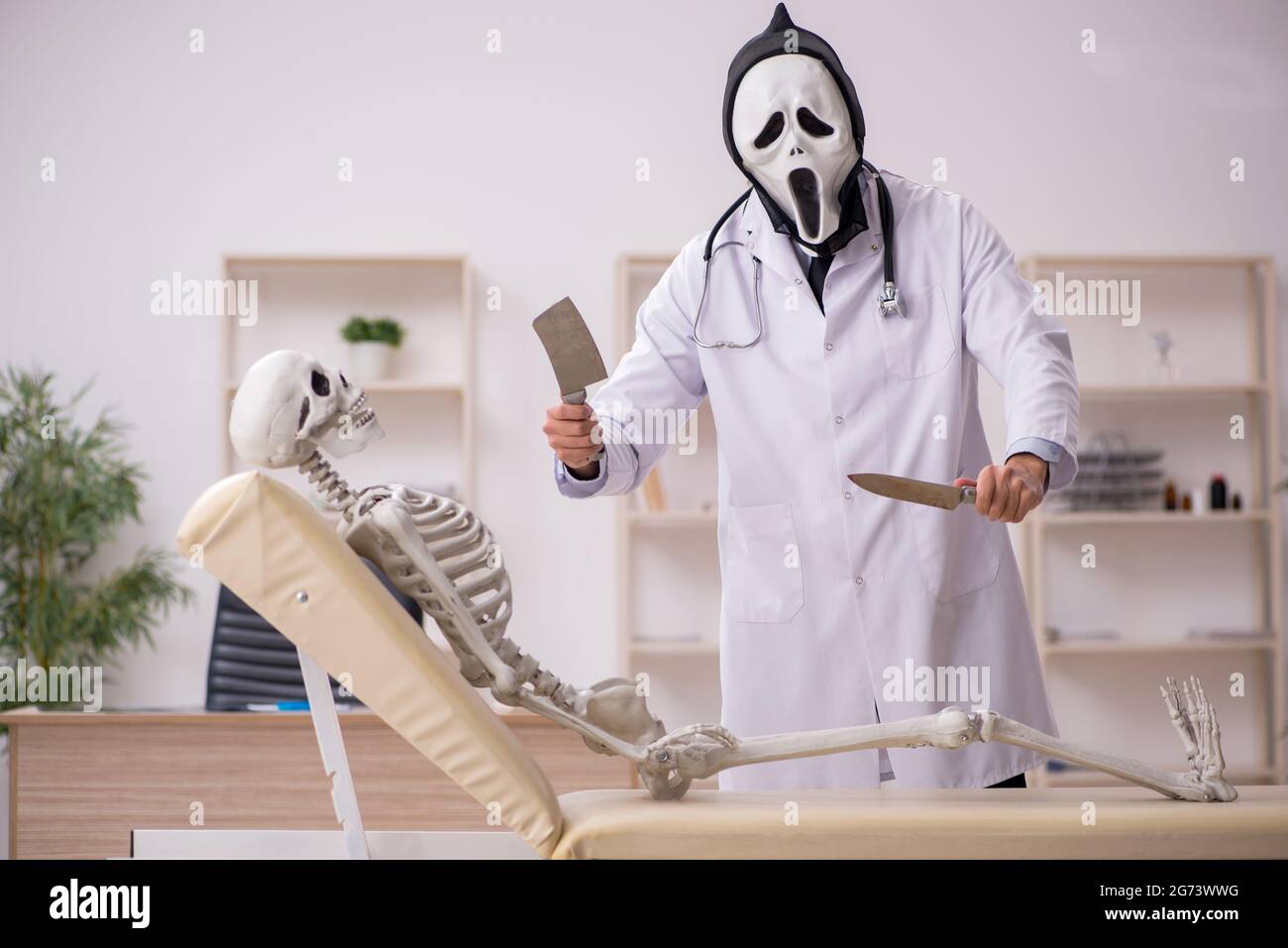 Devil doctor examining skeleton patient in the clinic Stock Photo - Alamy