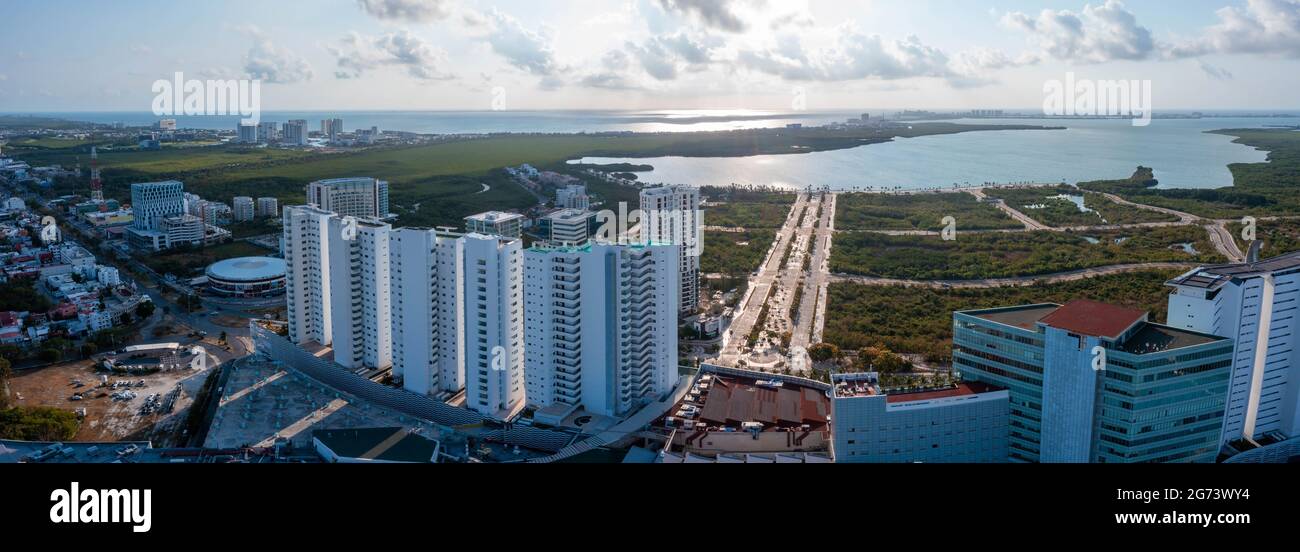 Busy street with small buildings near the beach area of Cancun Stock ...
