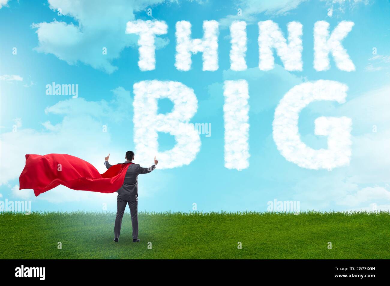 Think big concept with the businessman superhero Stock Photo - Alamy