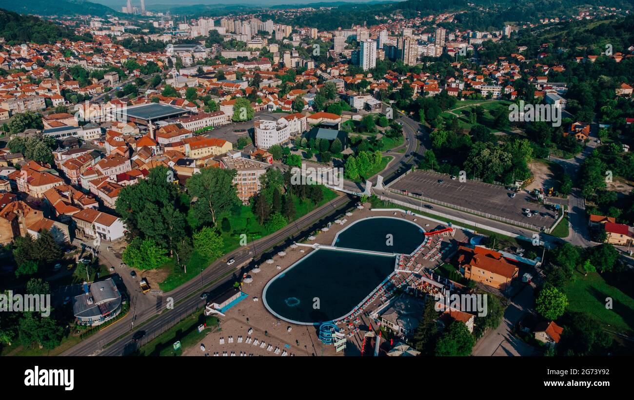 An aerial shot of the cityscape of Tuzla, Bosnia, with white buildings ...