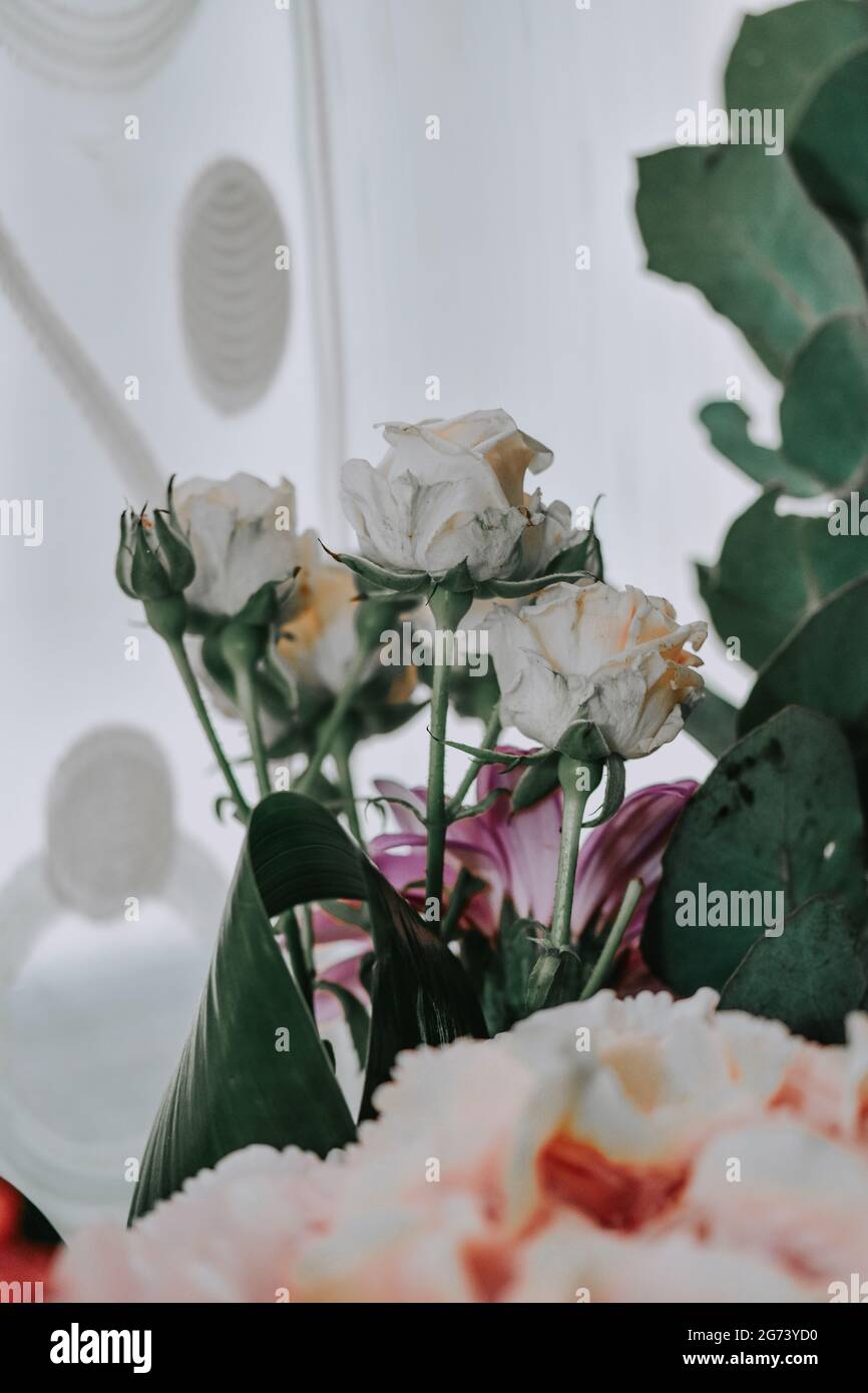 A vertical shot of a floral composition with different flowers Stock ...