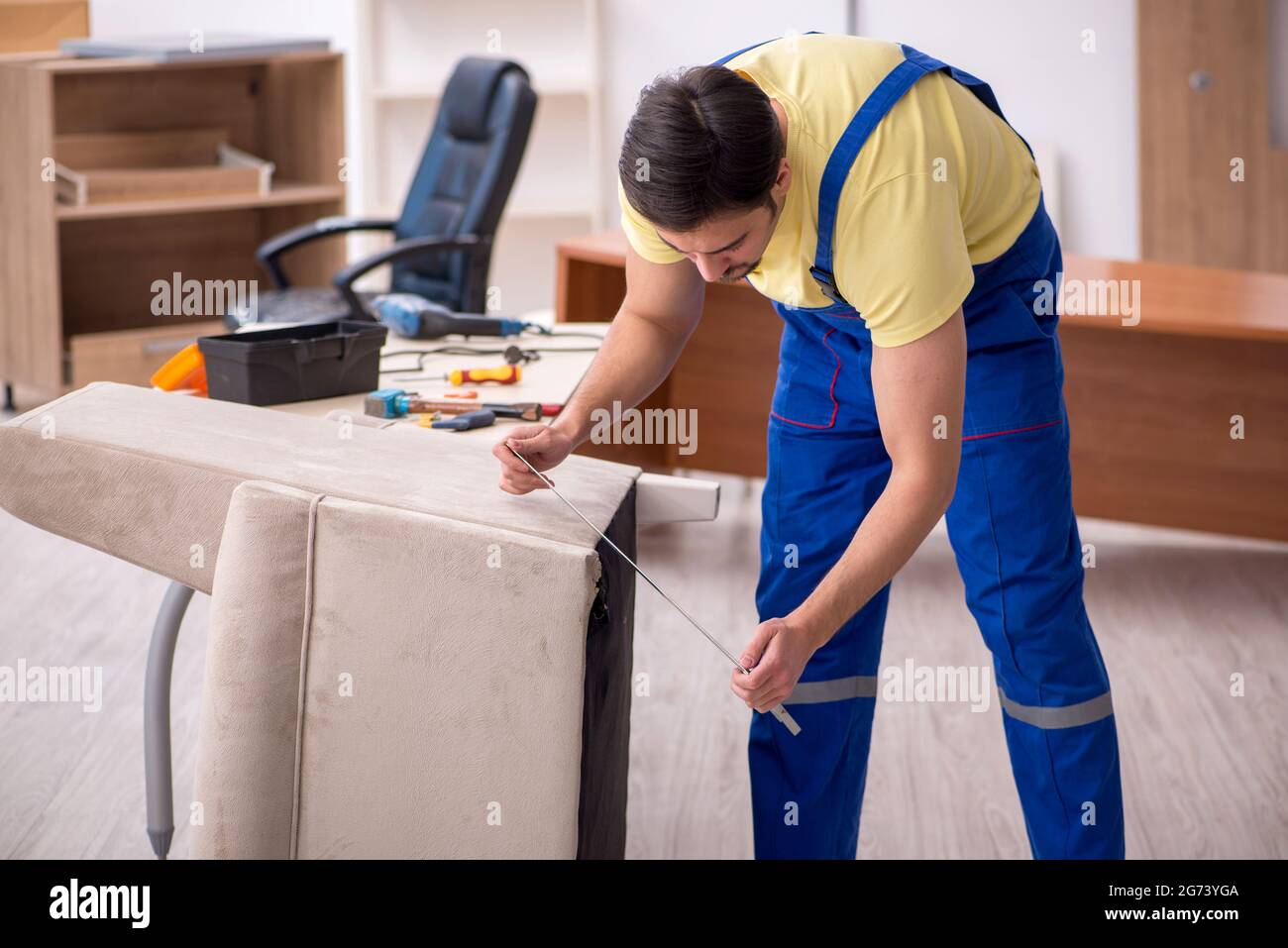 Carpenter measuring wooden chair hi-res stock photography and images ...