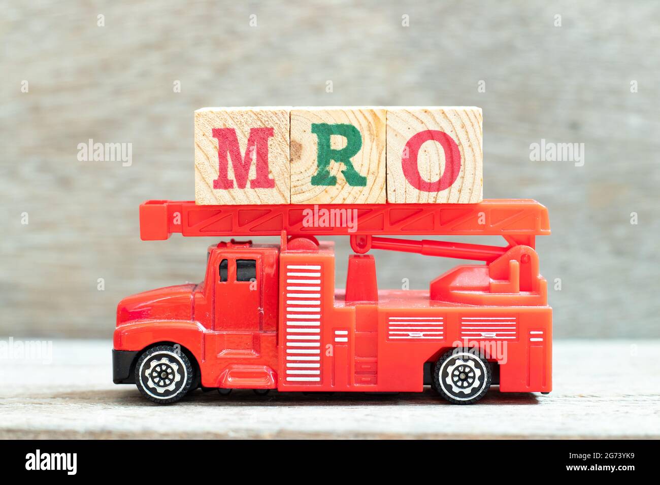 Fire ladder truck hold letter block in word MRO (Abbreviation of ...