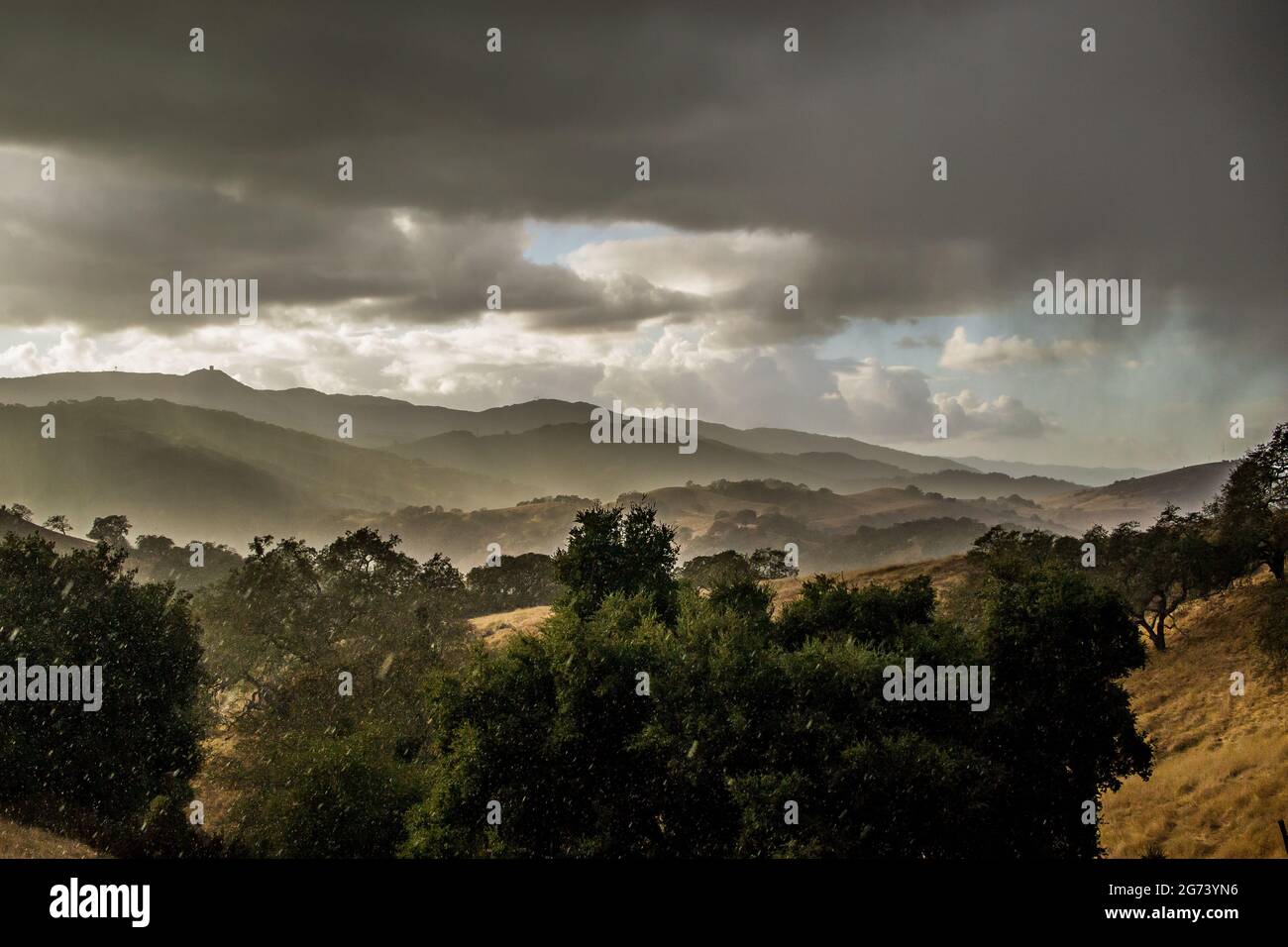 Santa Cruz Mountains, showing the peak of Mount Umunhum, during a hail ...