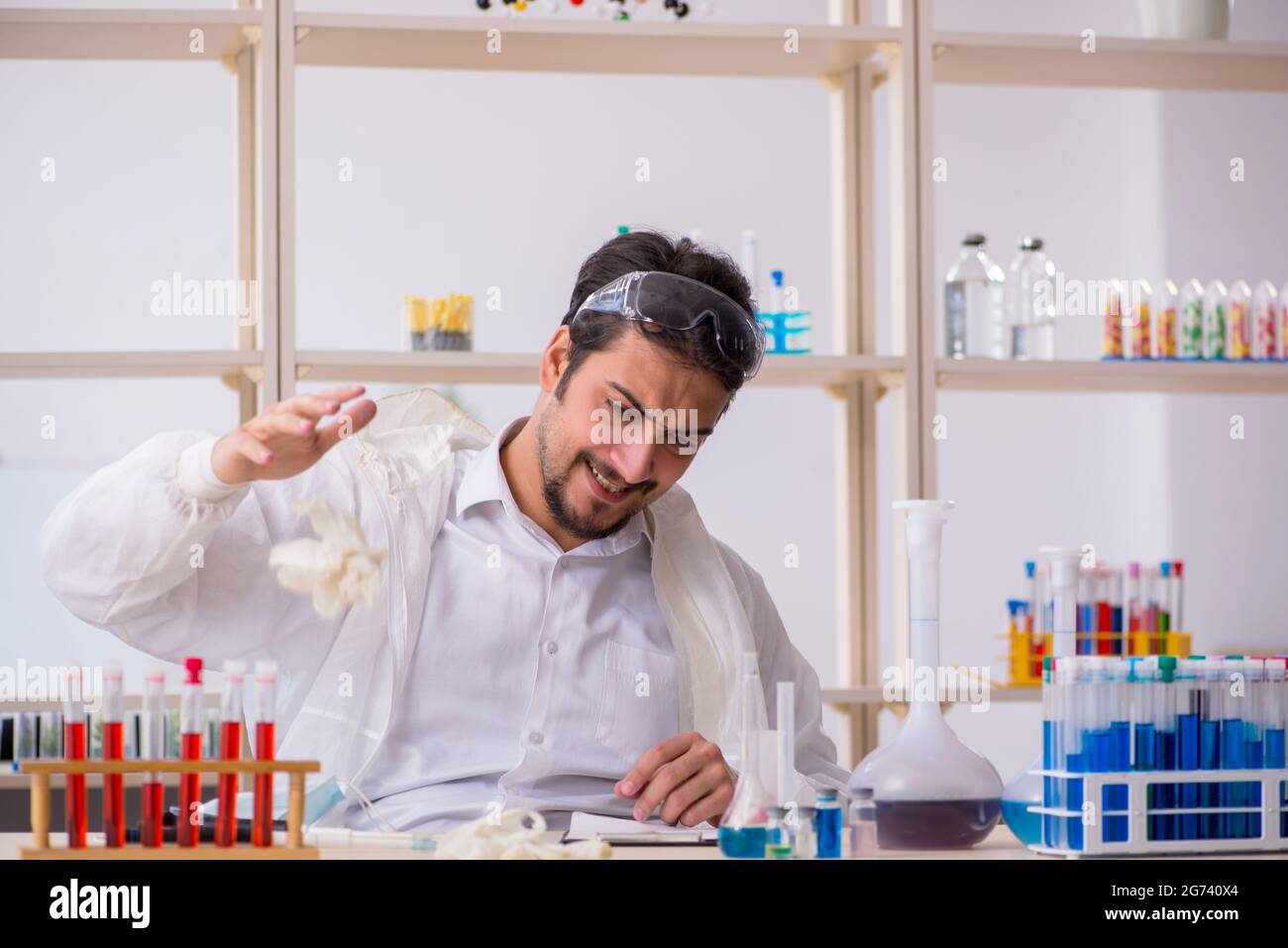 Young chemist extremely tired at the lab Stock Photo - Alamy