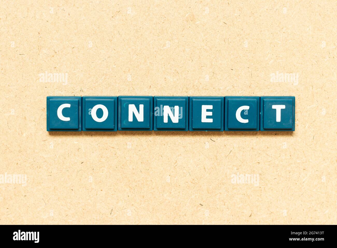 Tile alphabet letter in word connect on wood background Stock Photo - Alamy