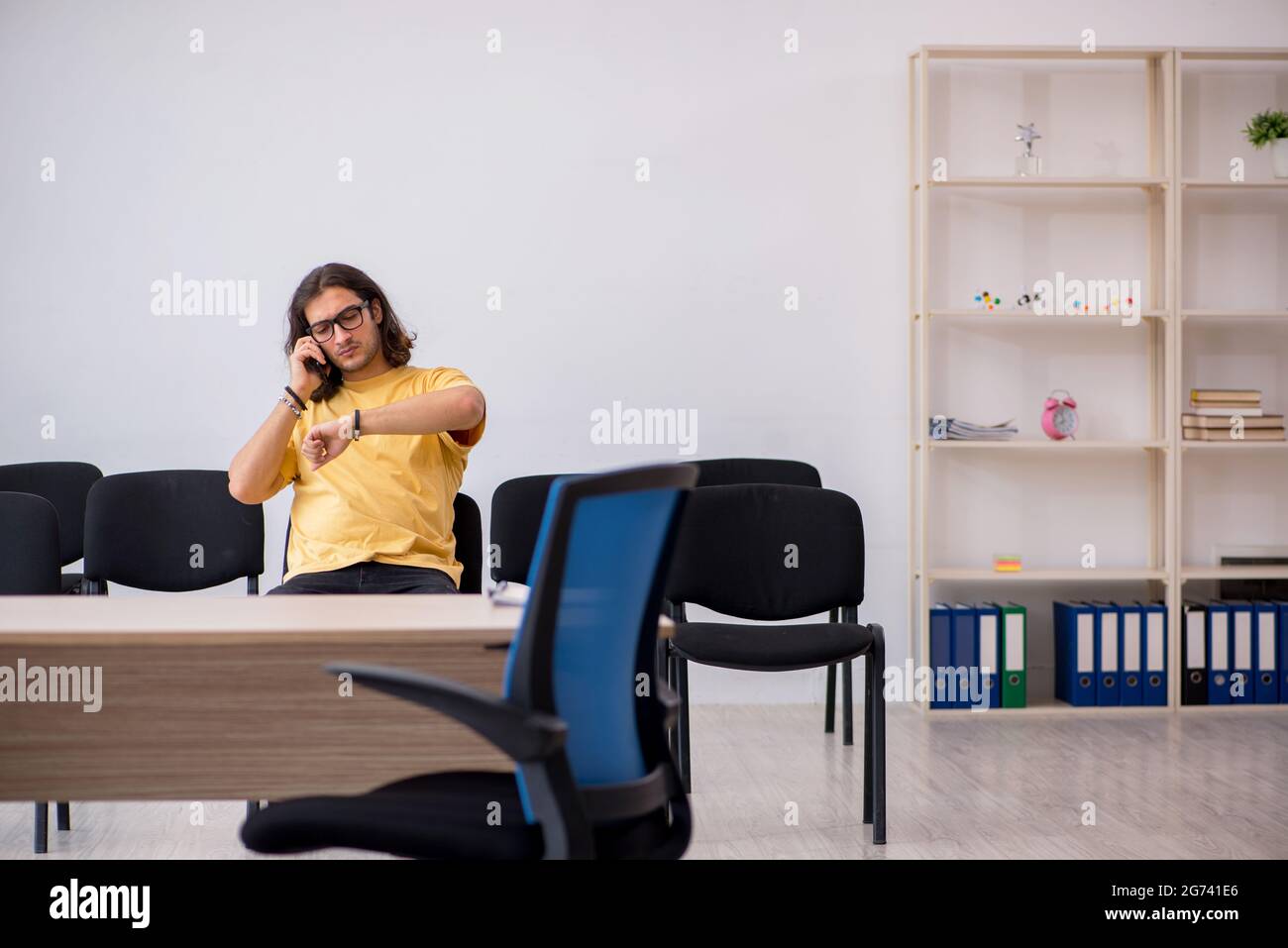 Student late to class looking at watch hi-res stock photography and ...
