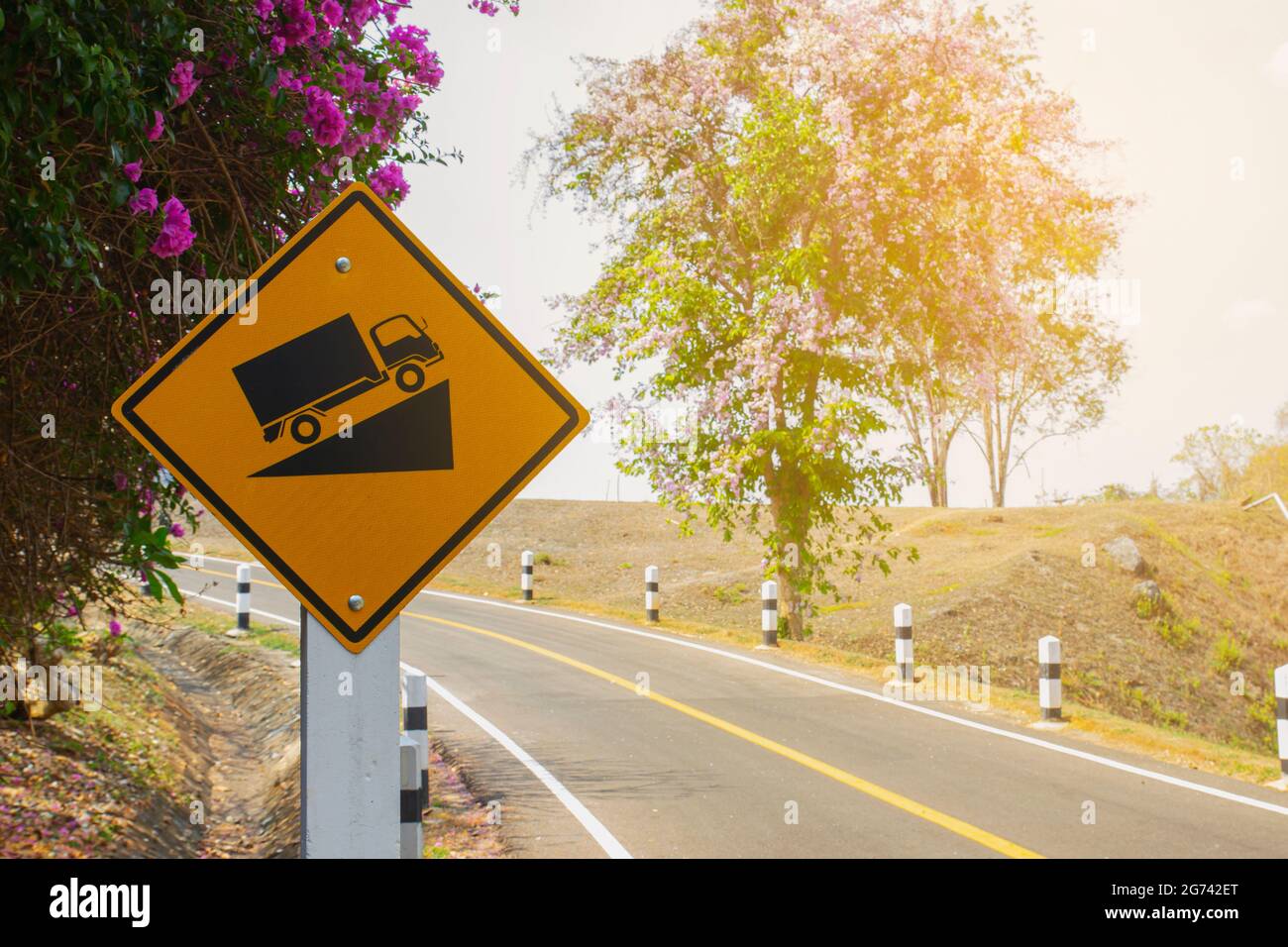 Traffic warning signs, the car is going up a steep slope Stock Photo ...