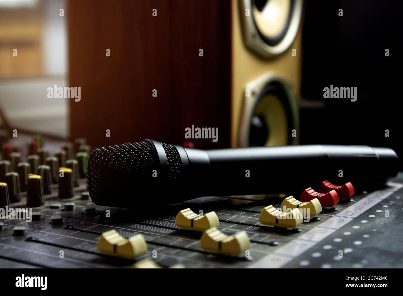 Close-up of wireless microphone on sound mixer in recording studio ...