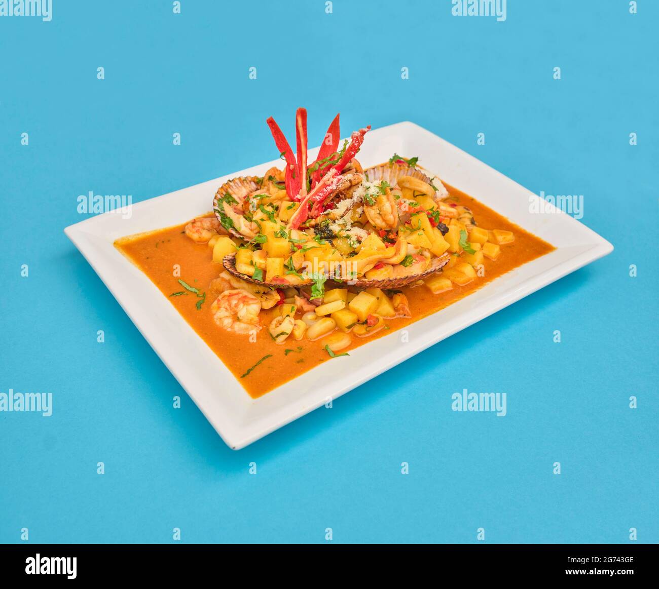 PERUVIAN FOOD: Picante de Mariscos with rice, sea food Stock Photo - Alamy