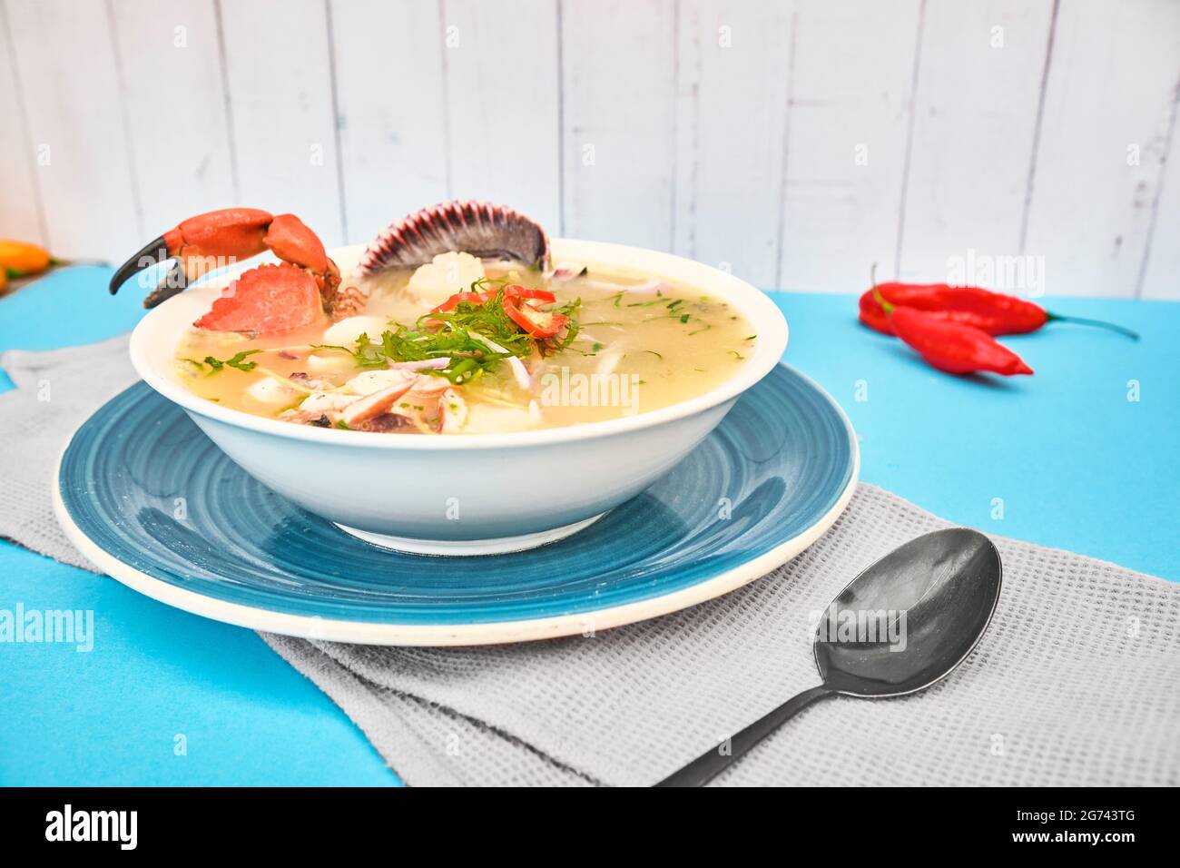 Delicious fish soup seafood called Chilcano Peruvian Food, decorated ...