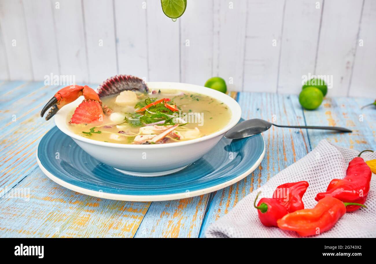 Delicious fish soup seafood called Chilcano Peruvian Food, decorated ...
