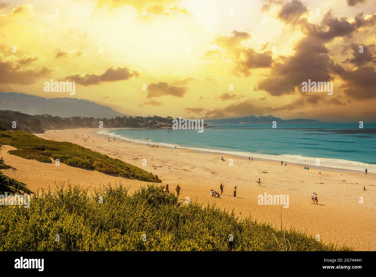a view from the top of Monterey's beautiful beach in summer sunset ...