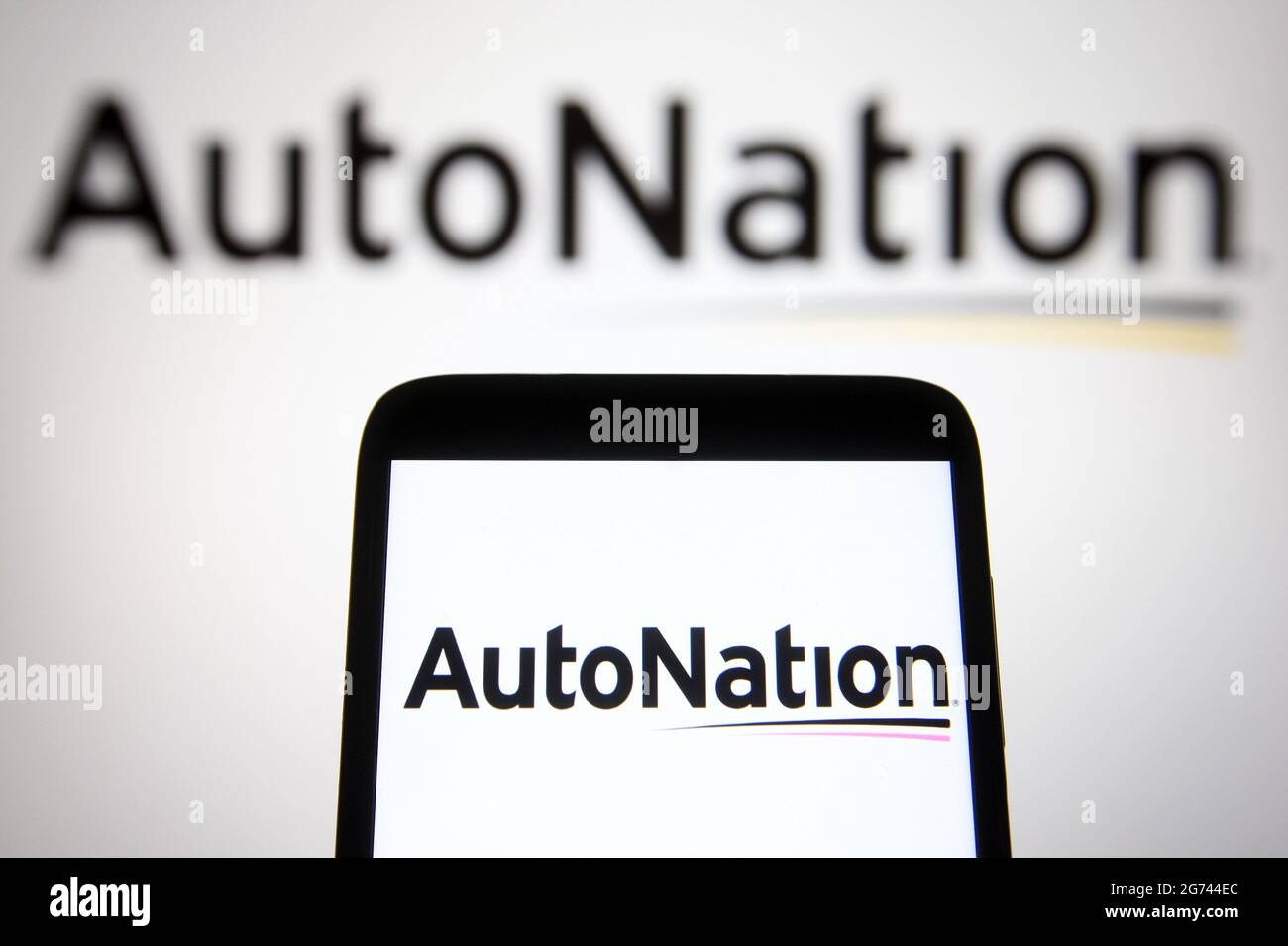 In this photo illustration, AutoNation logo of the US automotive ...