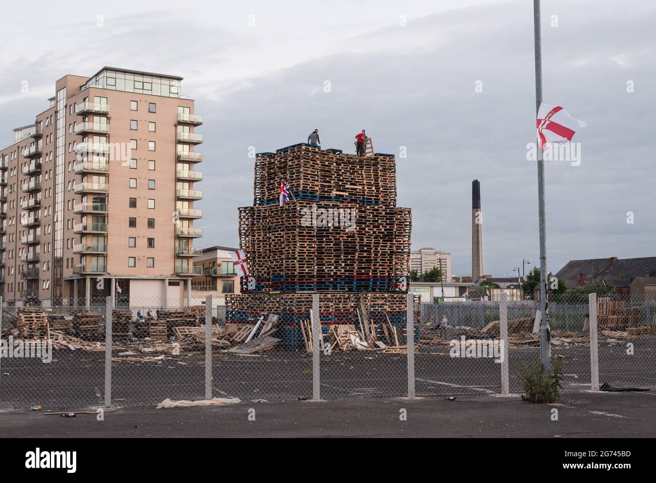Young men seen completing the construction of the bonfire in the Sandy ...