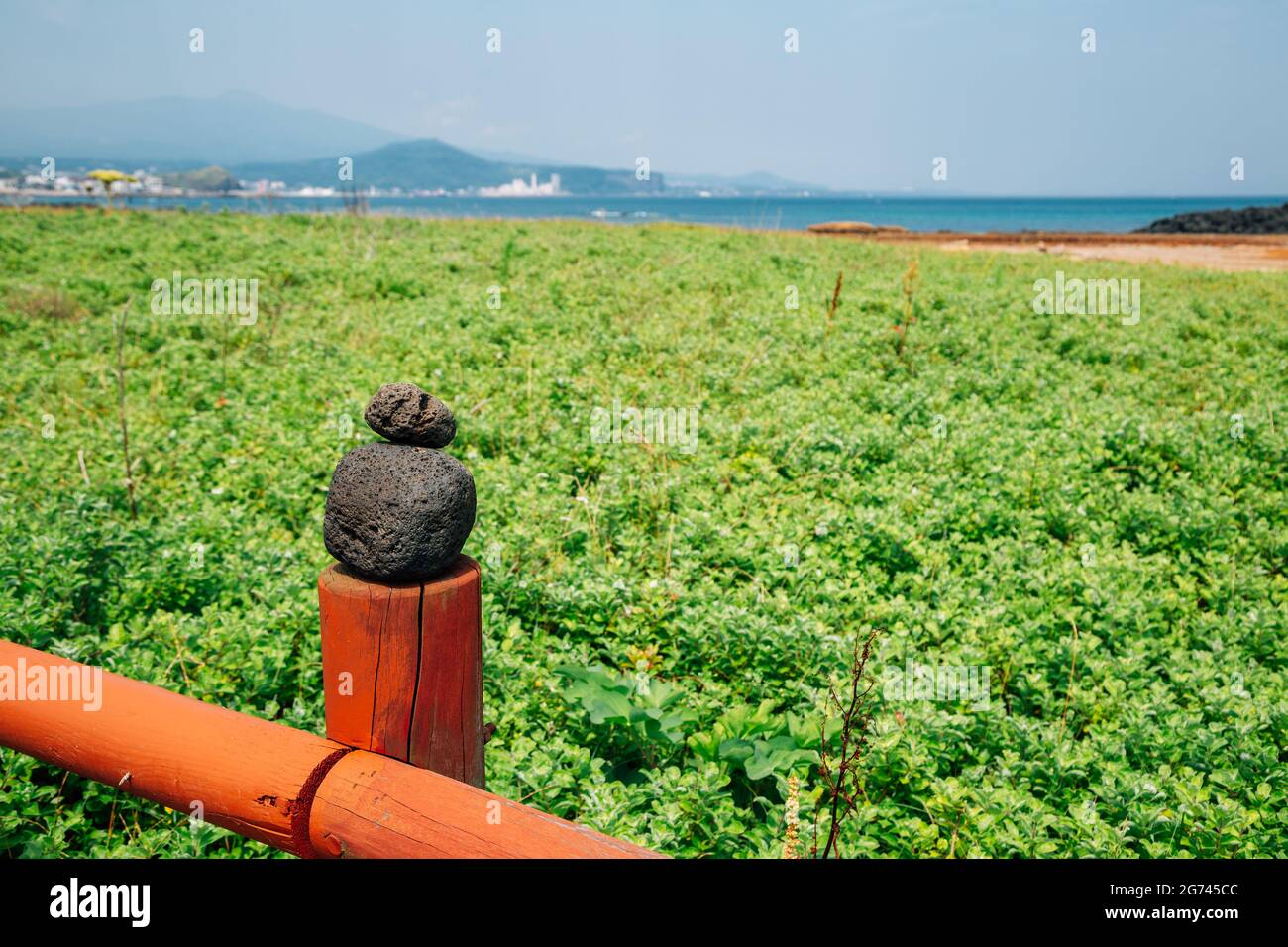 Beach and green field, Jeju Olle Trail in Jeju Island, Korea Stock ...