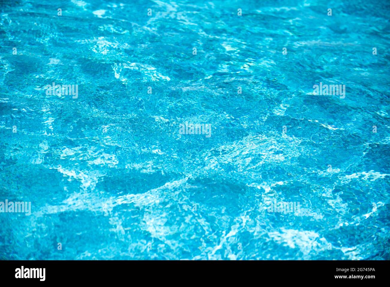 Abstract ripple wave and clear turquoise water surface in swimming pool ...