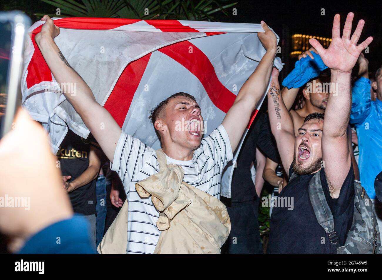London, UK. 10 Jul 2021. England fans screaming the three bombers chant ...
