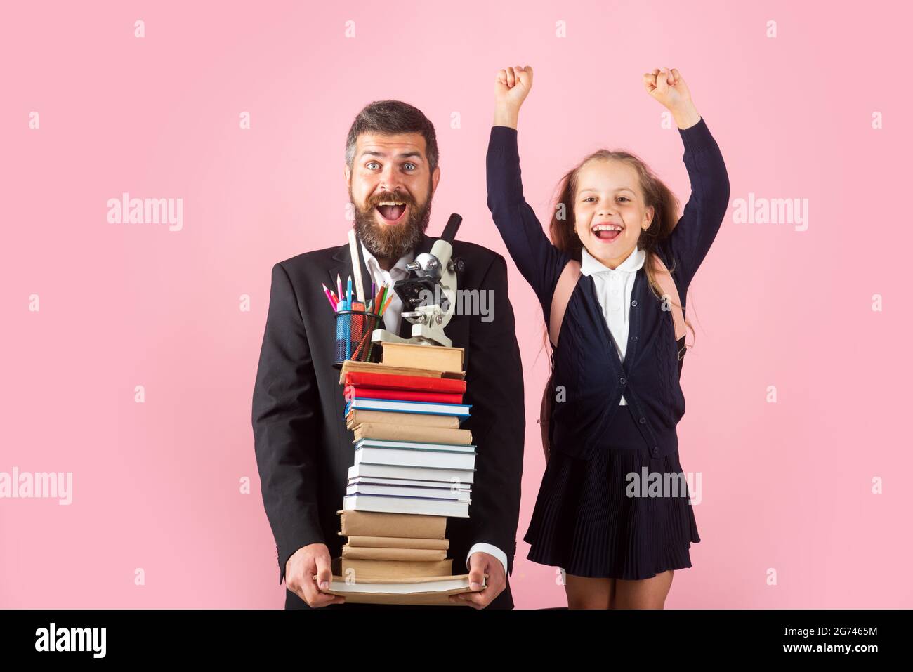 Father or teacher hold big stack school textbook notebook books. Back ...