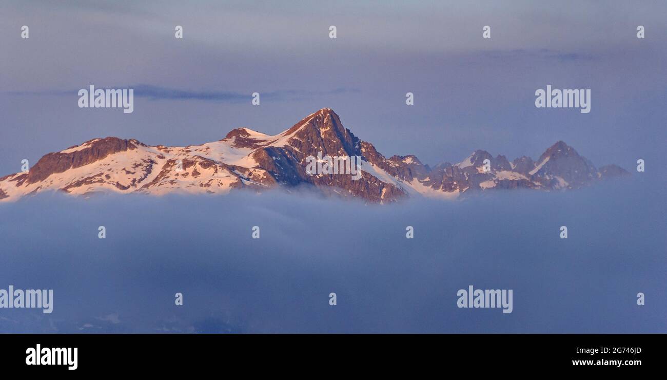 Montardo summit above a sea of clouds, seen from Pla de Beret (Aran ...