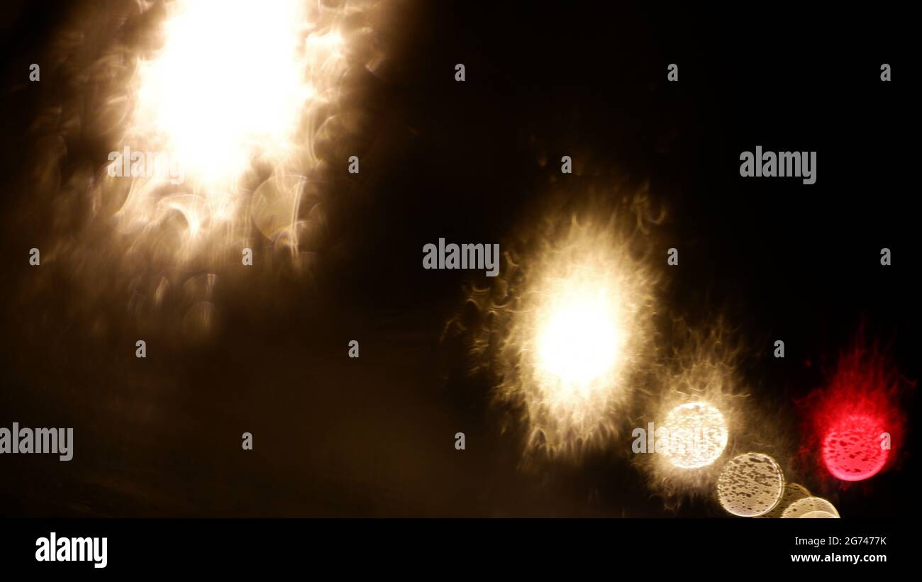 the dim car lights in the dark night black background Stock Photo - Alamy