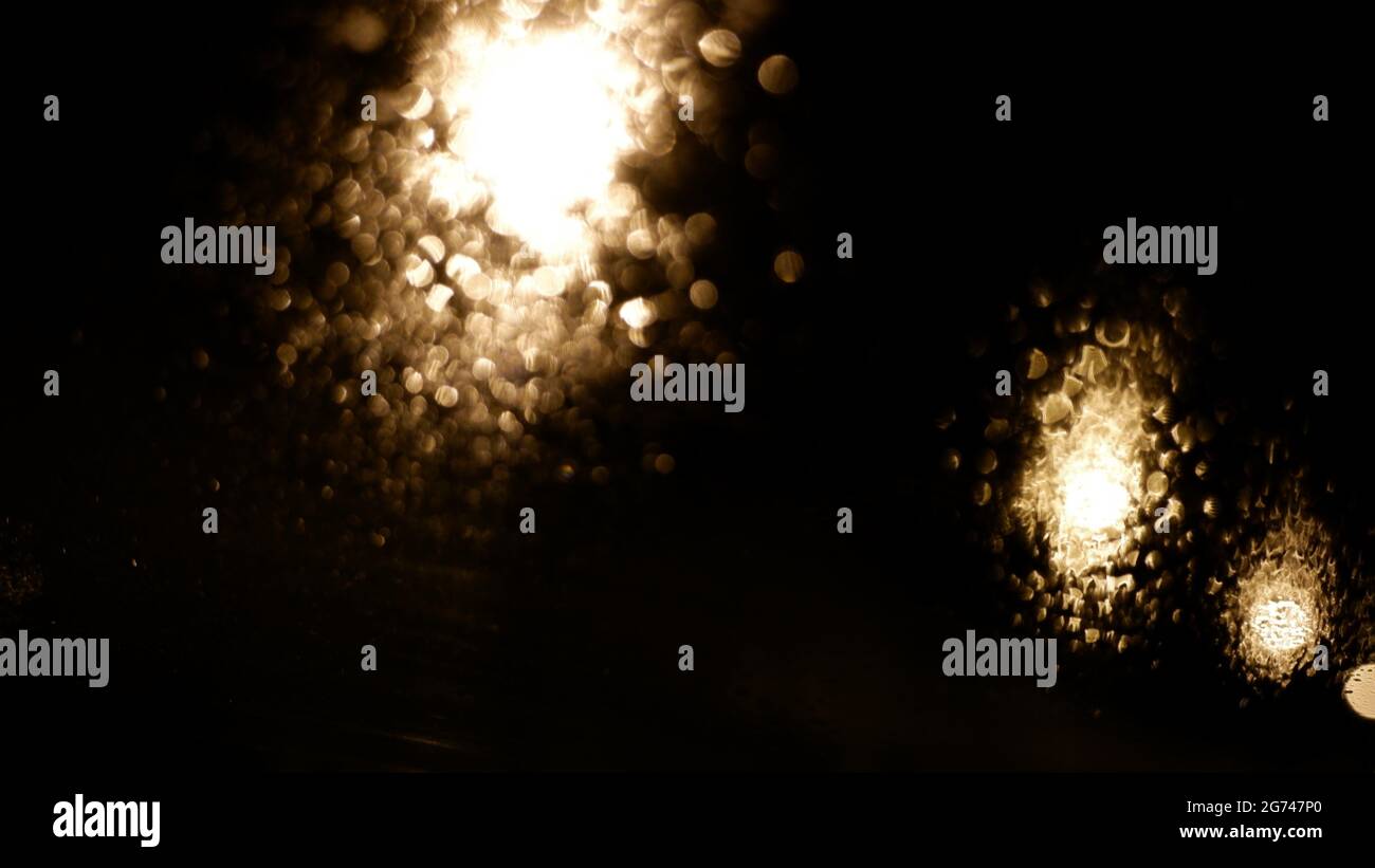the dim car lights in the dark night black background Stock Photo - Alamy