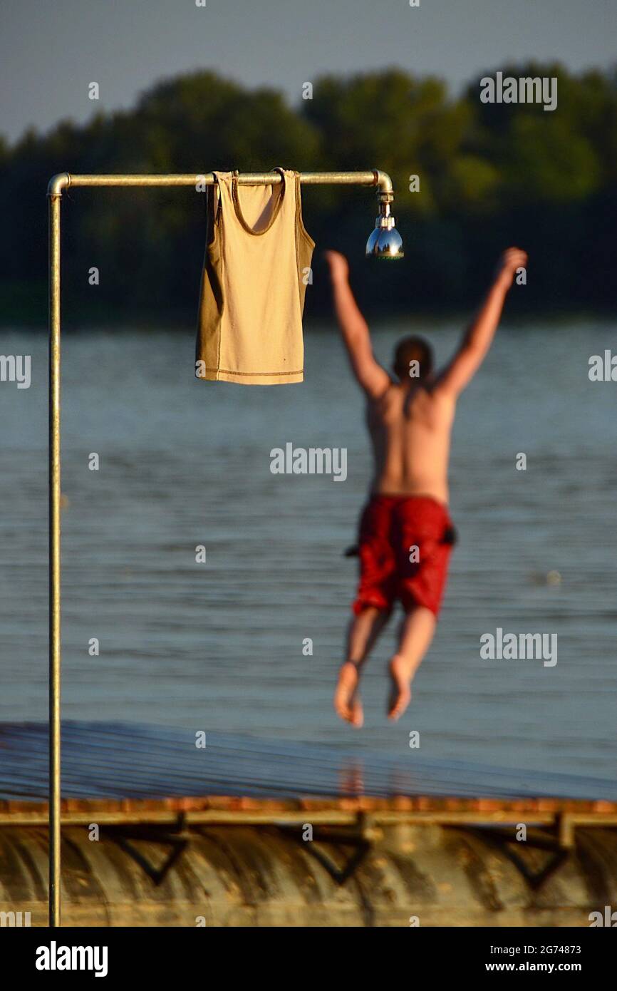 Young swimmer jumps hi-res stock photography and images - Alamy
