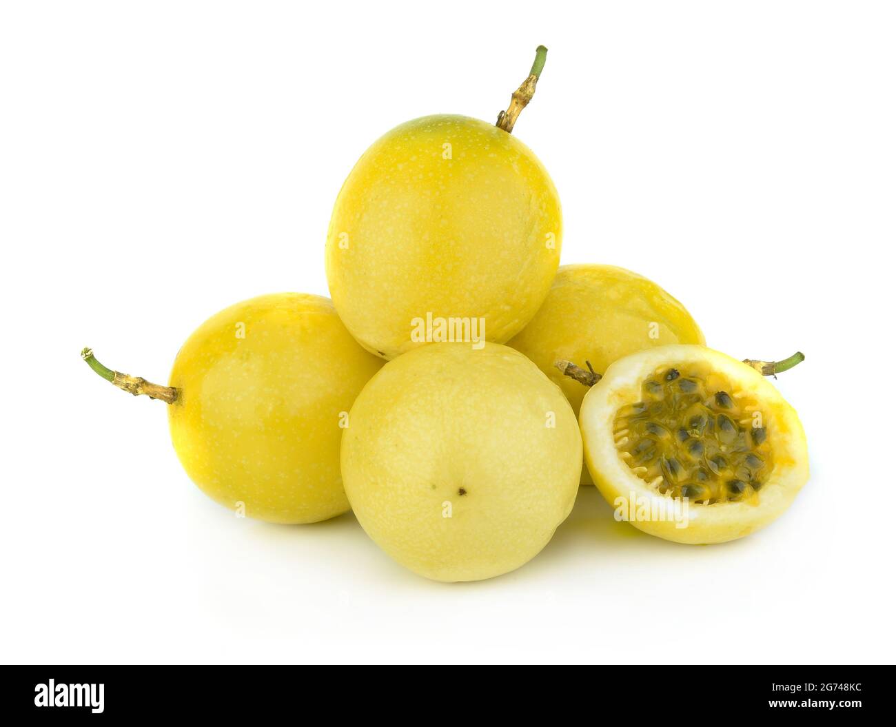 A pile of yellow passion fruits isolated on a white background Stock ...