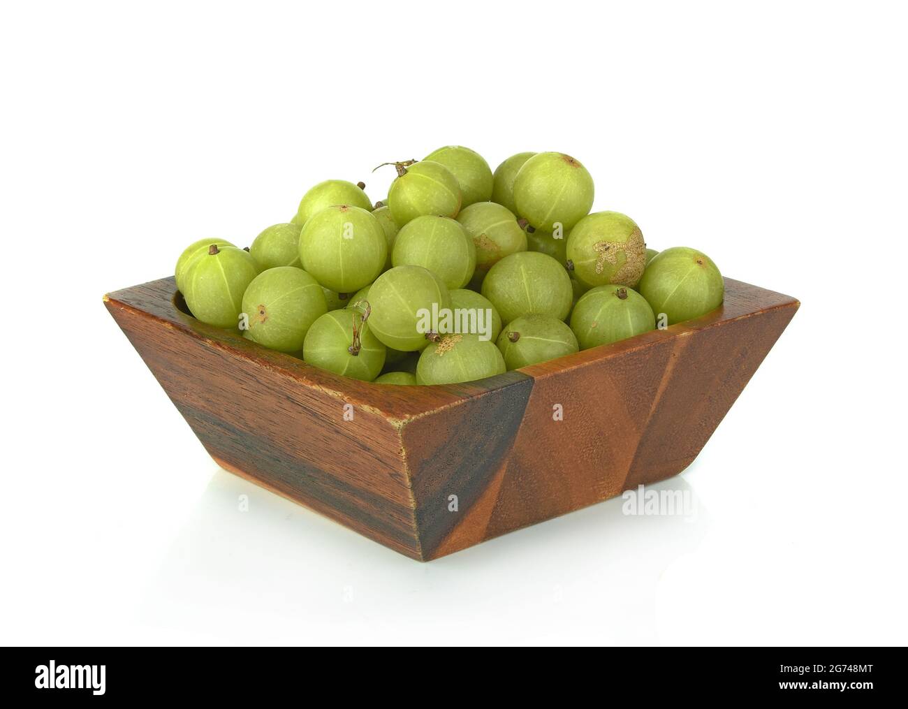 A bowl with fresh gooseberries isolated on a white background Stock ...