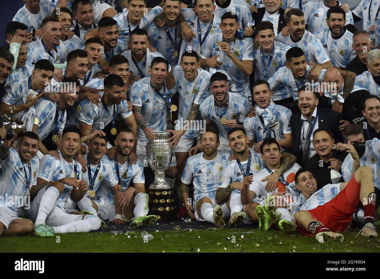 Argentina's Lionel Messi holds the trophy as he celebrates with ...