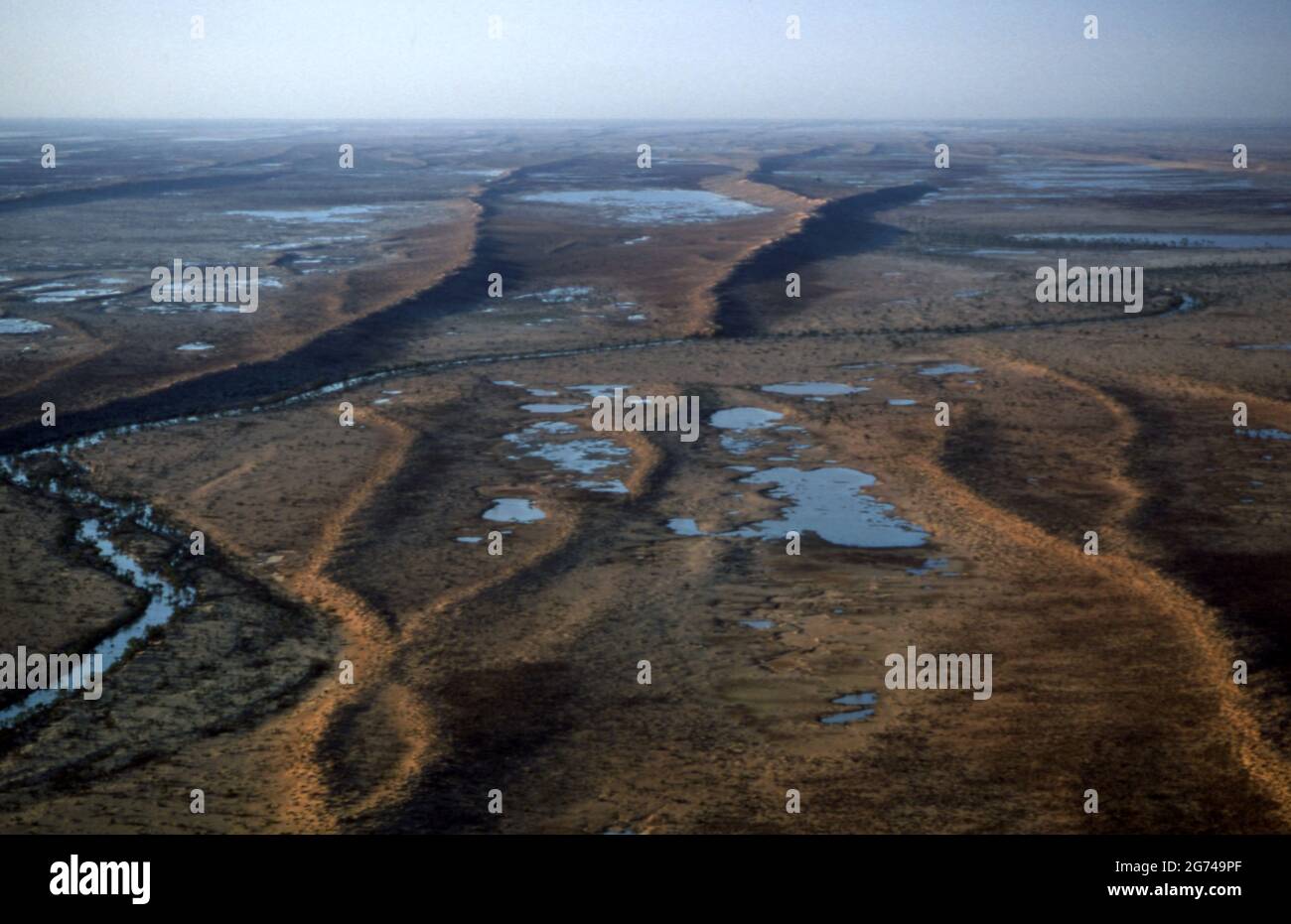 AERIAL OF THE FLOOD PLAINS AND PARALLEL SAND DUNES OF THE SIMPSON ...