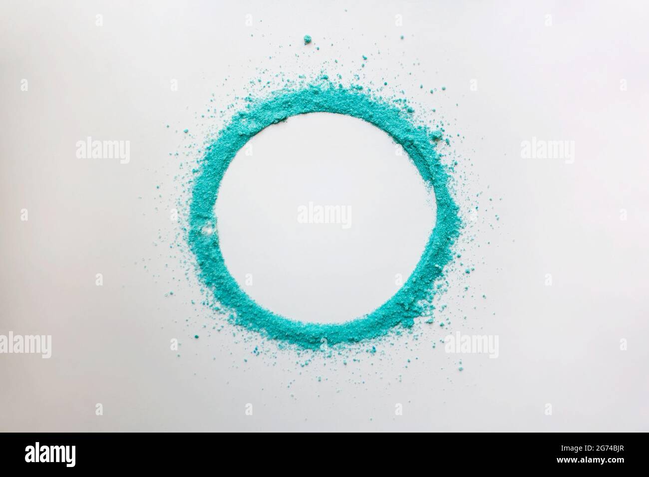 Turquoise colored powder circle frame on white background Stock Photo ...