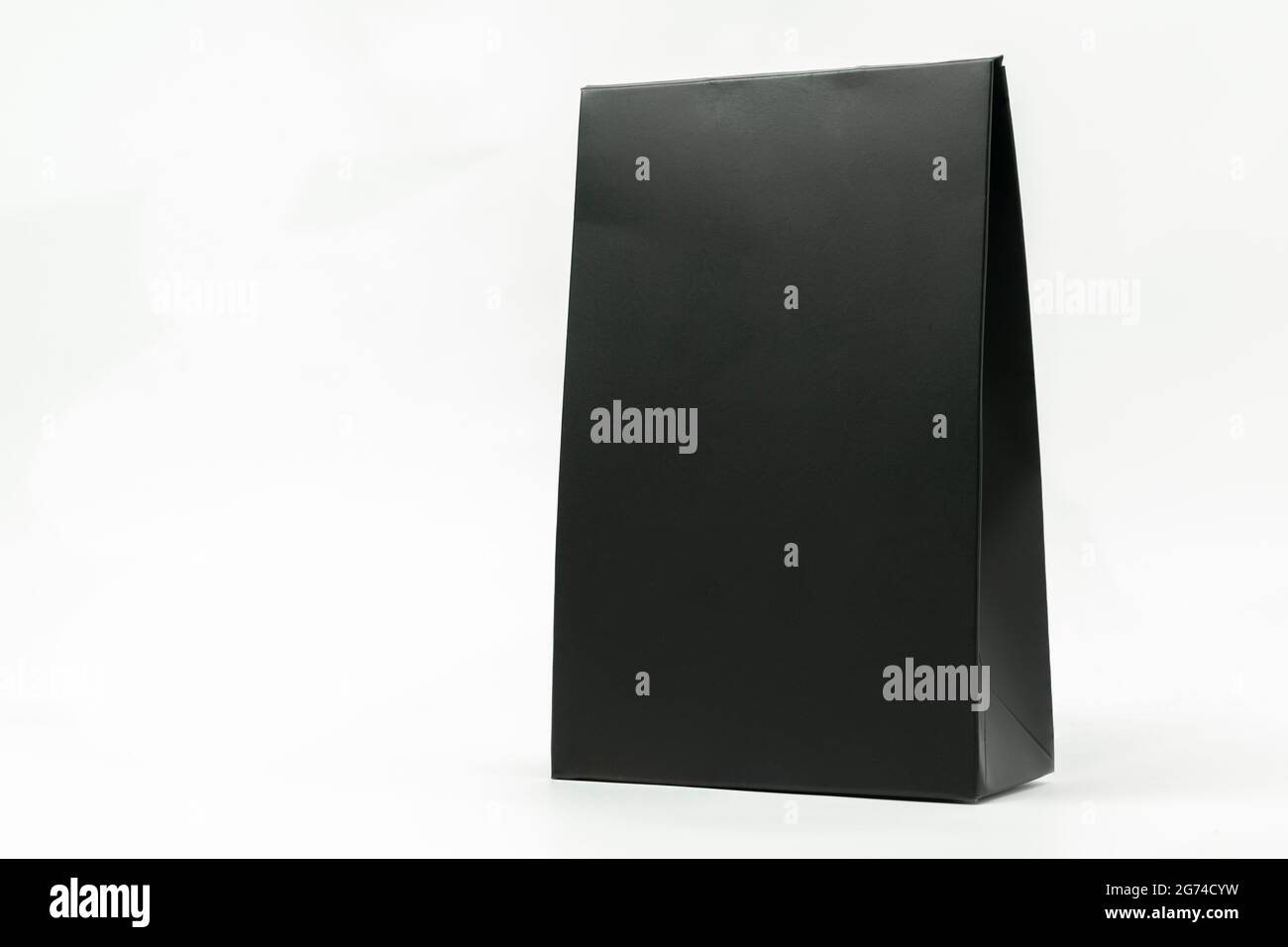 Isolated a black paper packaging, hard paper package on white ...
