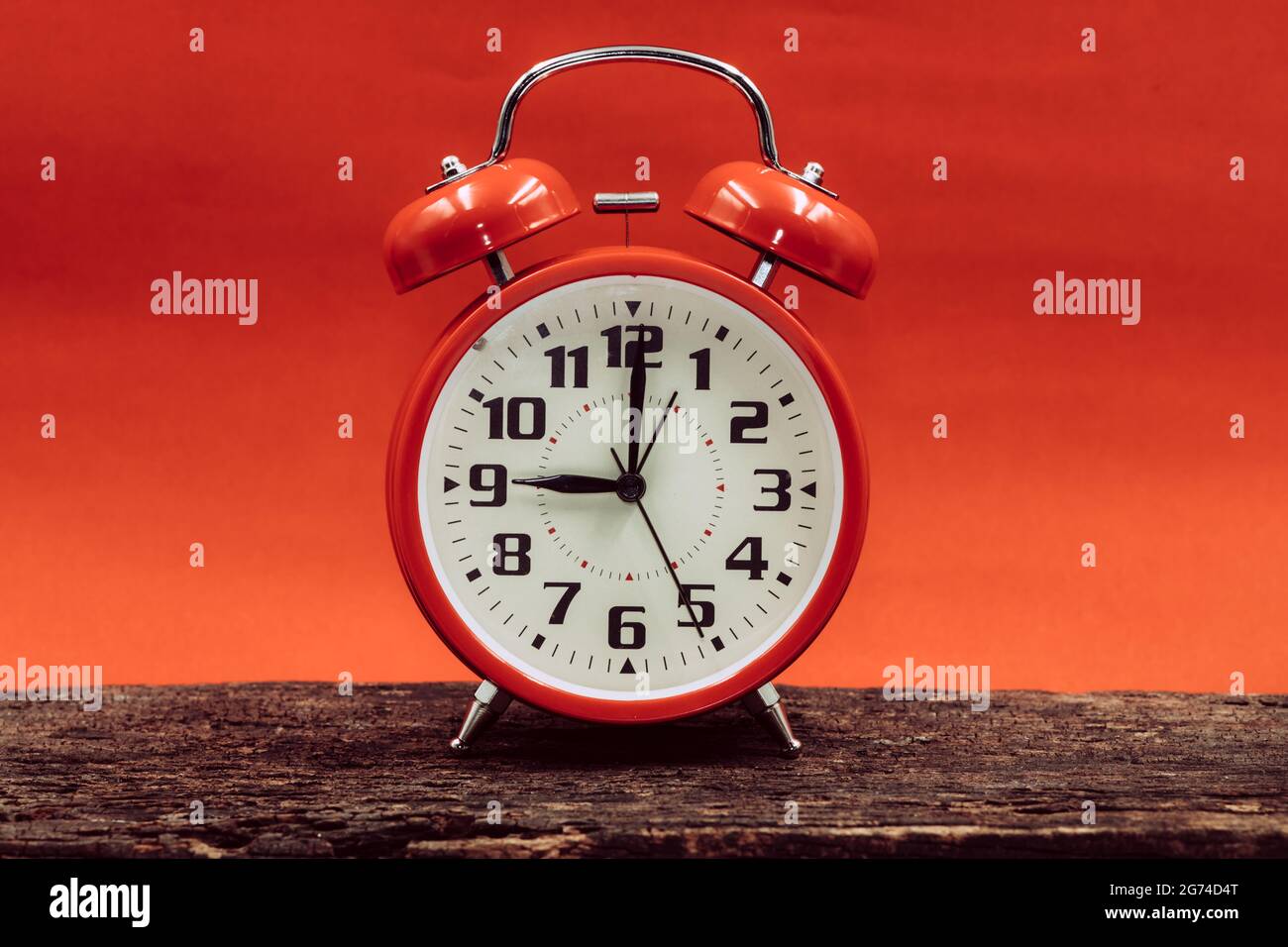 9 o'clock retro clock on wooden with red sun dusk dawn day sky ...