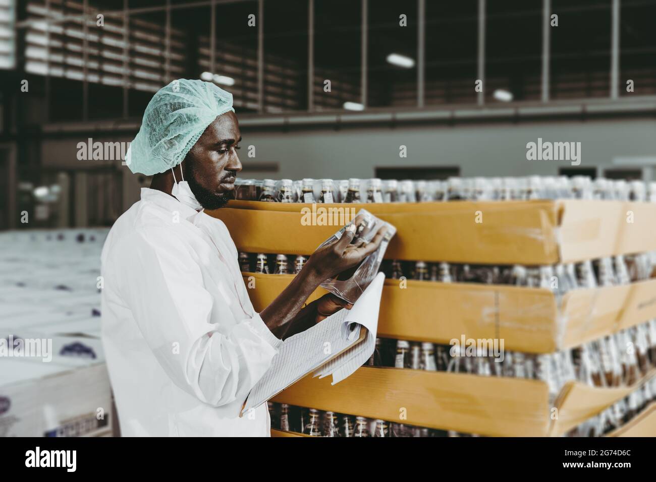 Black African worker working in industry factory products checking ...