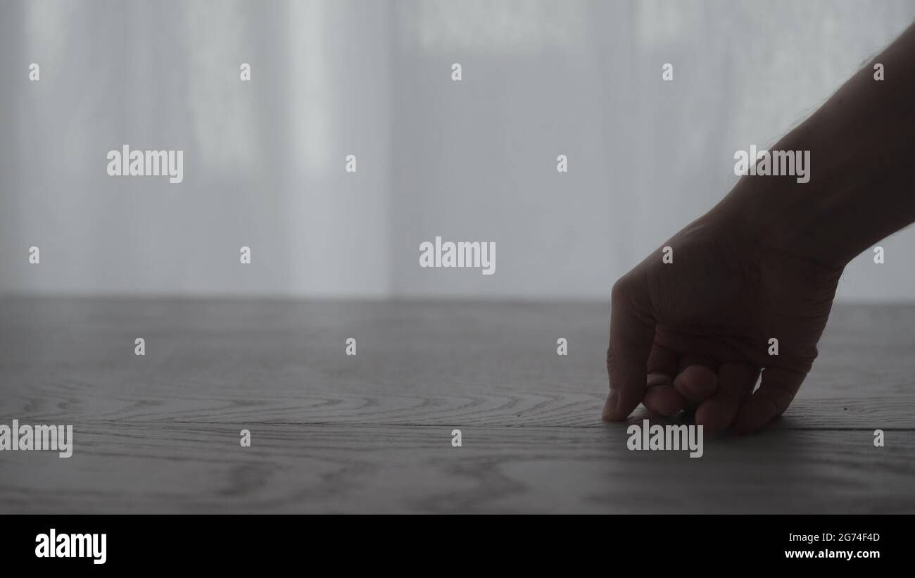 man hand touch white oak table, wide photo Stock Photo - Alamy