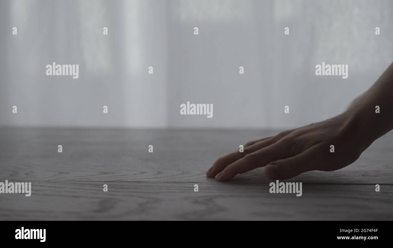 man hand touch white oak table, wide photo Stock Photo - Alamy