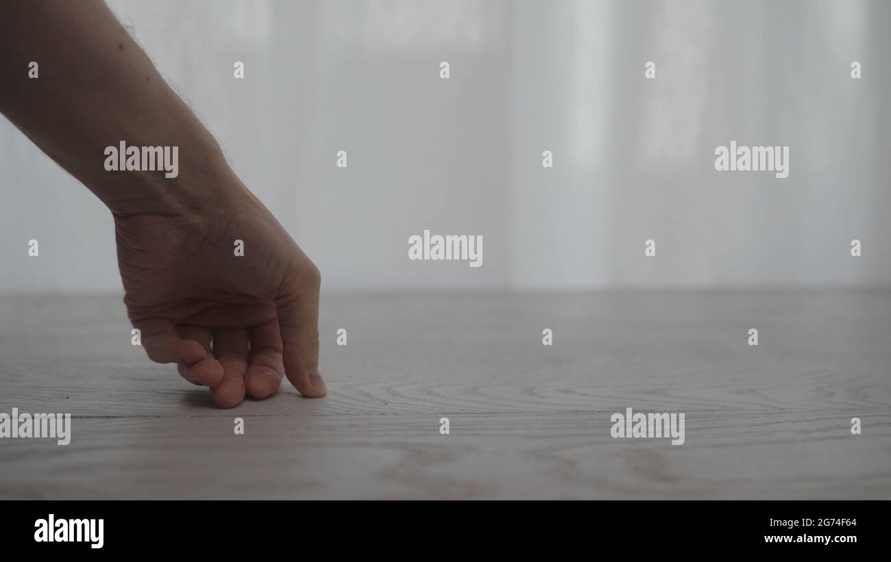 man hand touch white oak table, wide photo Stock Photo - Alamy