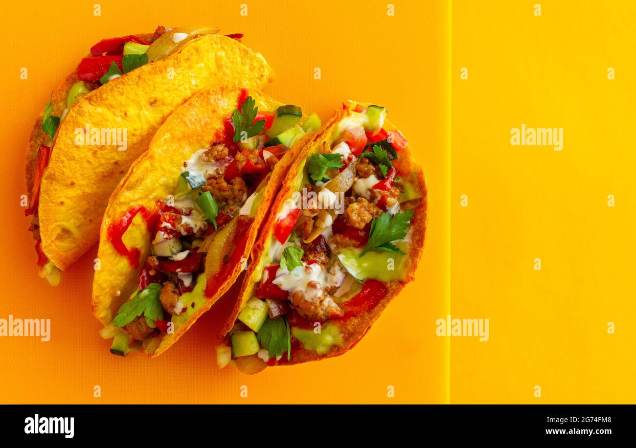 Mexican taco with Chicken on a yellow background Stock Photo - Alamy