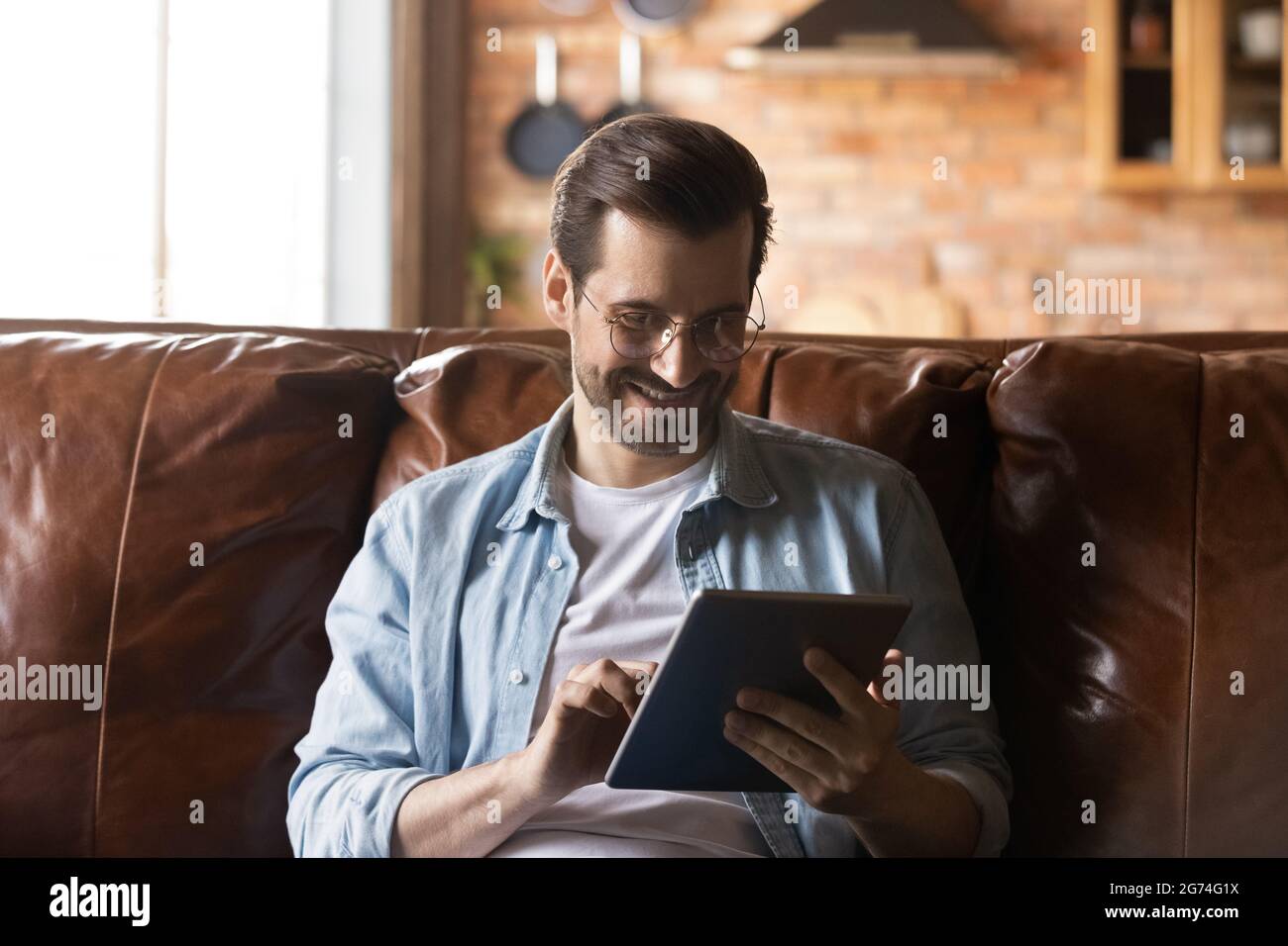 Happy employee man tablet hi-res stock photography and images - Alamy