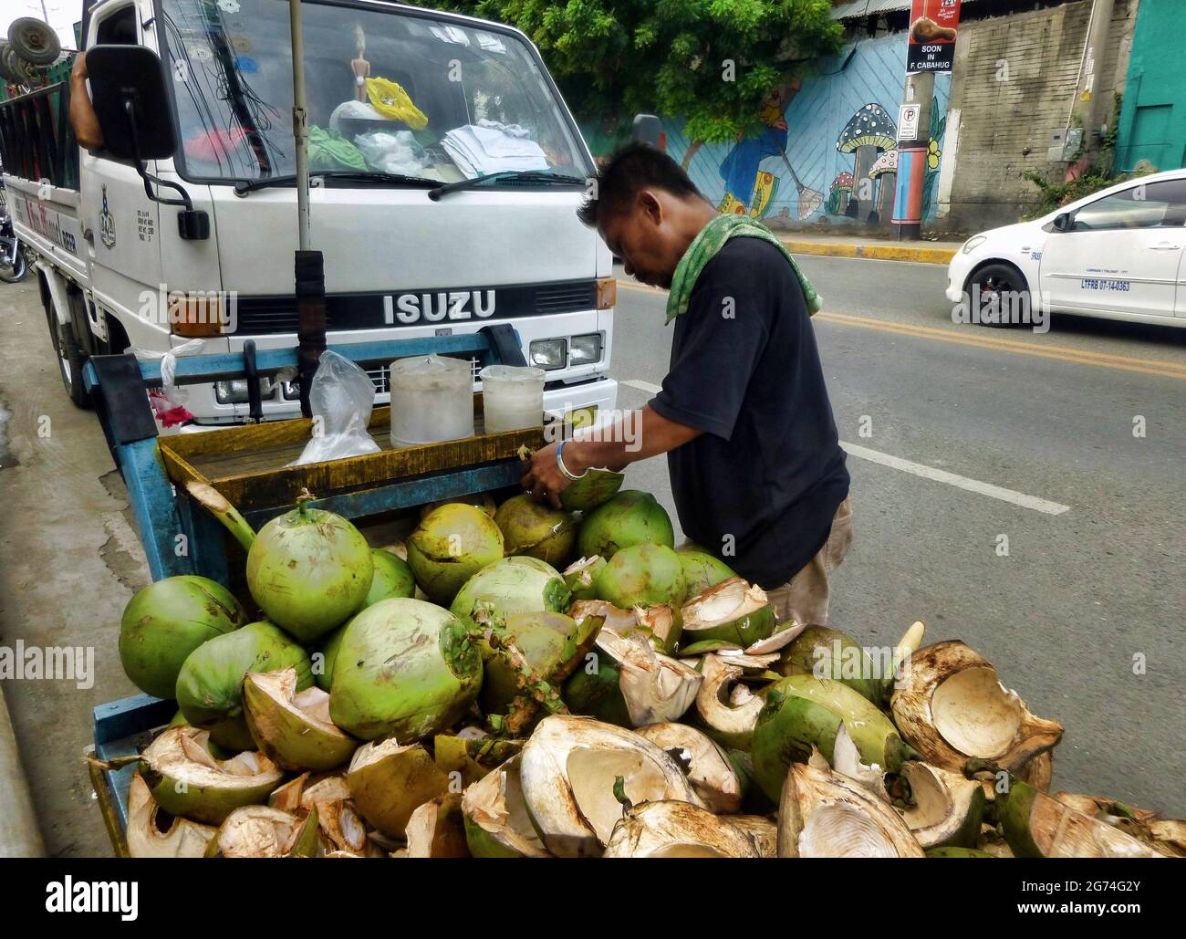 Hawking coconuts at roadside hi-res stock photography and images - Alamy