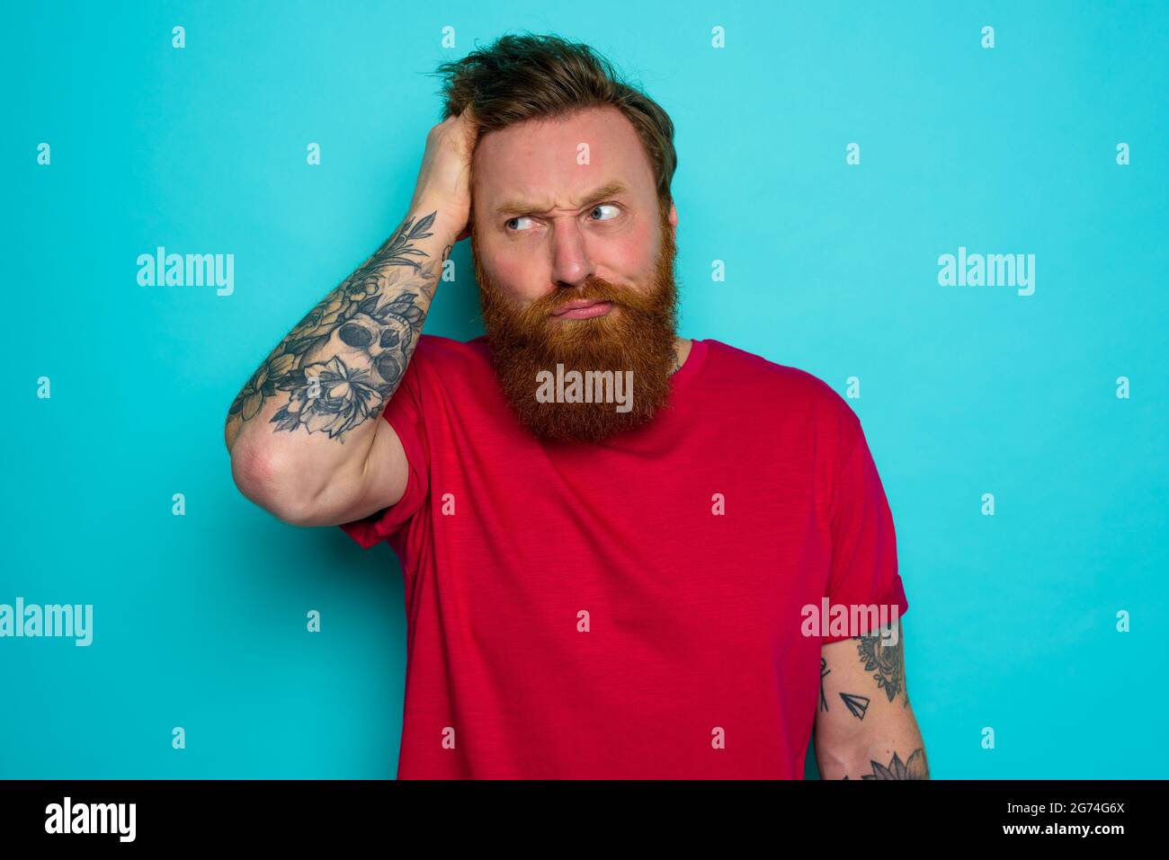 Man with beard is confused and stressed Stock Photo - Alamy
