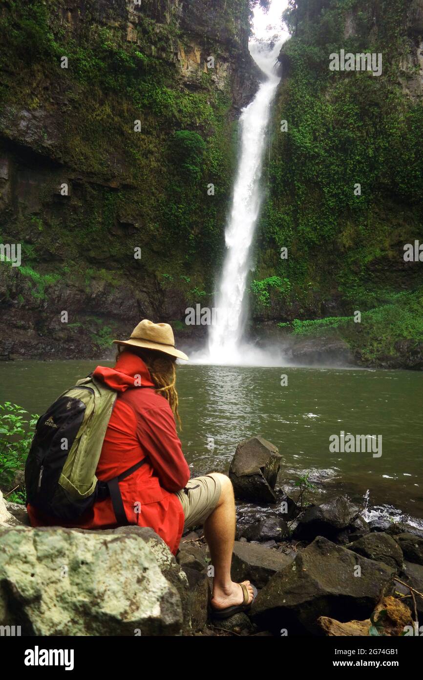 Hiker at Nandroya Falls, Palmerston Section, Wooroonooran National Park ...