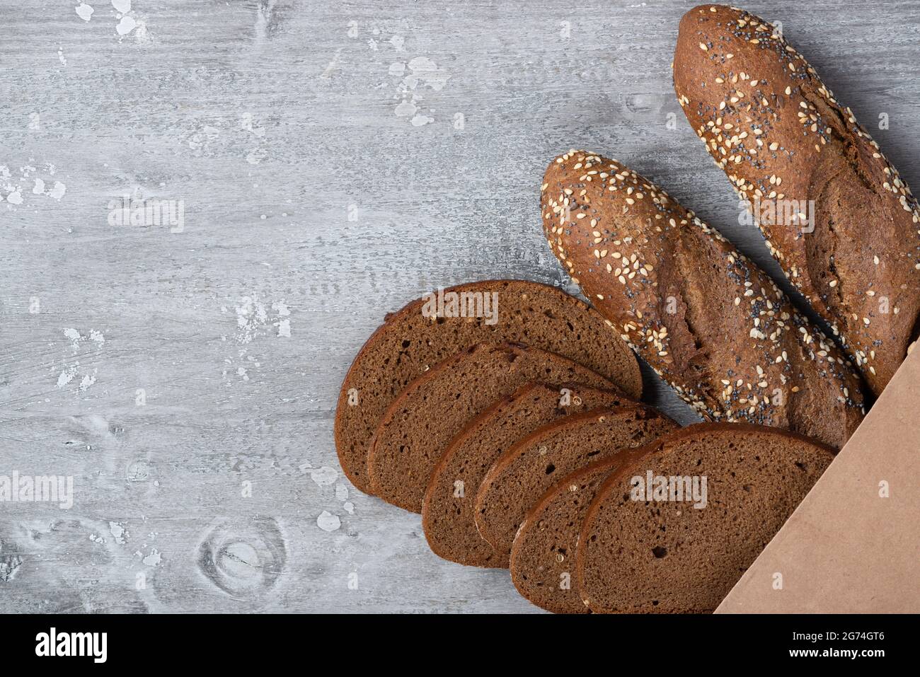 Rye bread in a paper bag on the table Stock Photo - Alamy